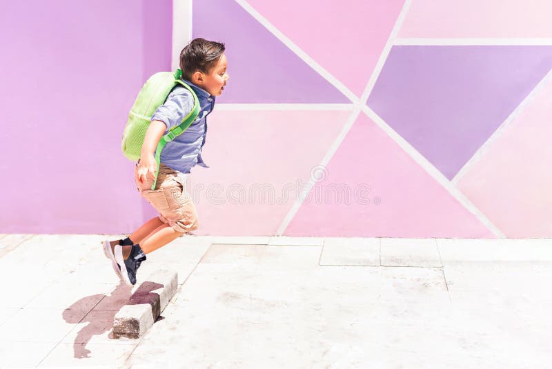 Little Boy Jumping with His Backpack on the Way To Class. Back To ...