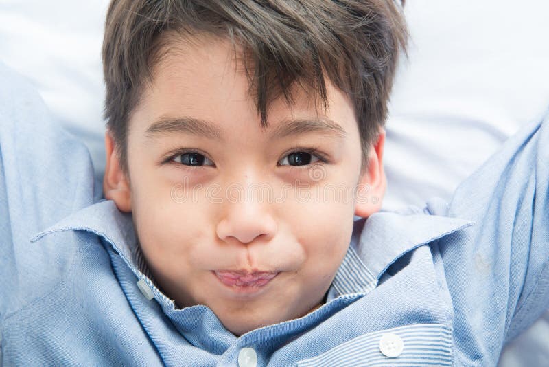 Little Boy Laying Down on the Bed Cute Beautiful Face Stock Photo ...