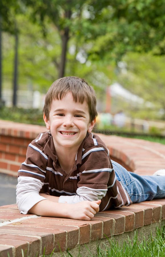 Little Boy Laying Down Smiling Picture. Image: 5475080