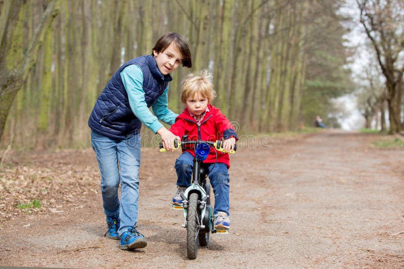 Little Boy, Learning How To Ride a Bike in the Park Stock Image - Image ...