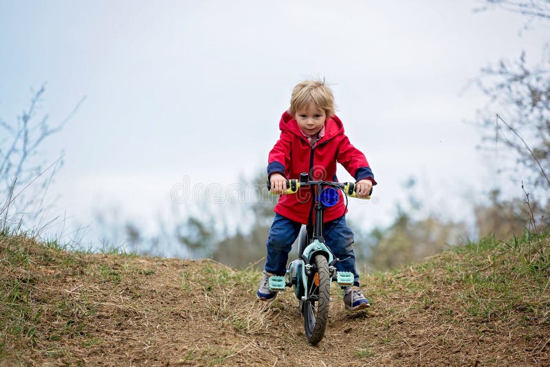 Little Boy, Learning How To Ride a Bike in the Park Stock Image - Image ...