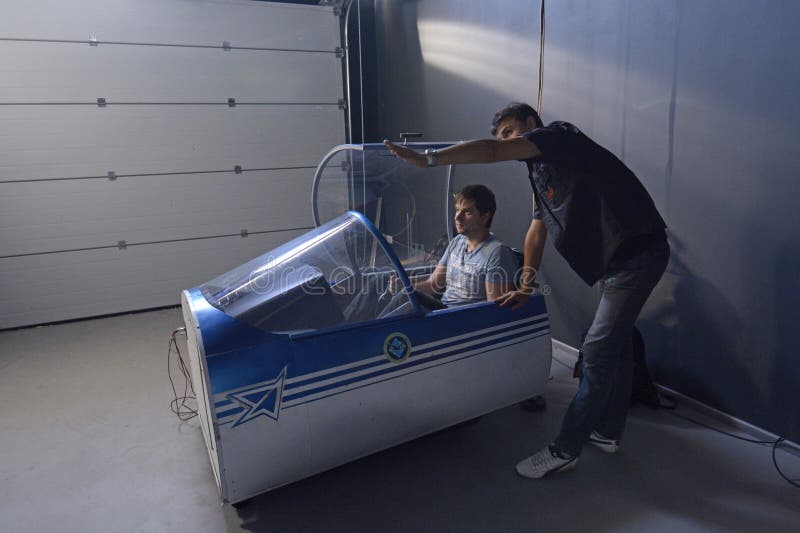 Little Boy Learning To Fly with a Flight Simulator, Instructor Teaching ...
