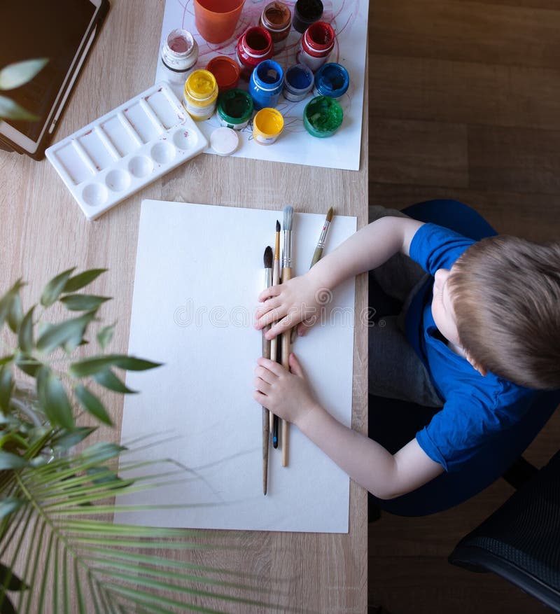 A Little Boy Learns To Draw from an Online Lesson Stock Image - Image ...