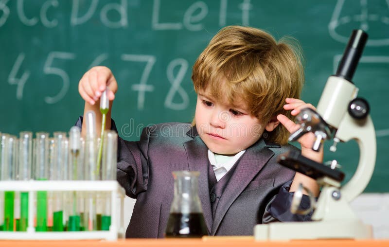 Little Boy at Lesson. Back To School. Little Boy is Making Science ...