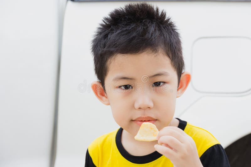 Little boy like eat snacks stock image. Image of face - 90655193