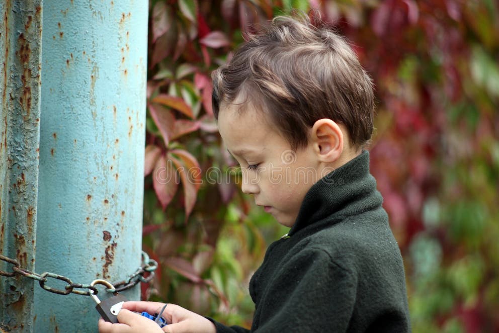 Little boy at lock door stock photo. Image of curly, attractive - 59767422