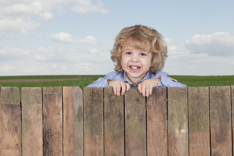 Boy Looking from Above a Fence. Wood Landscap Stock Image - Image of ...