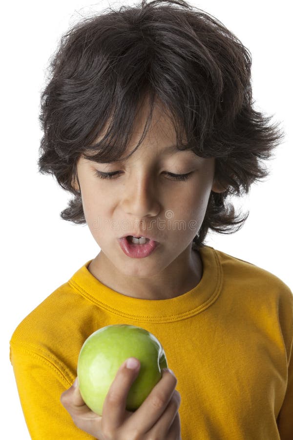 Little Boy Looking at a Green Apple Stock Photo - Image of food, years ...