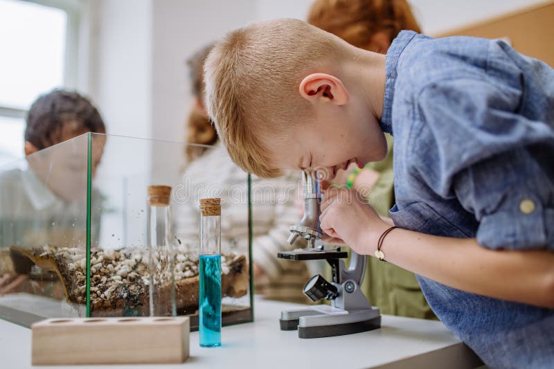 Little Boy Looking in Microscope during Science Lesson. Stock Image ...