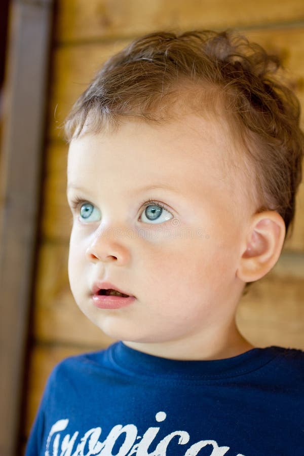 Little boy looks up stock image. Image of facial, shoulders - 20579885
