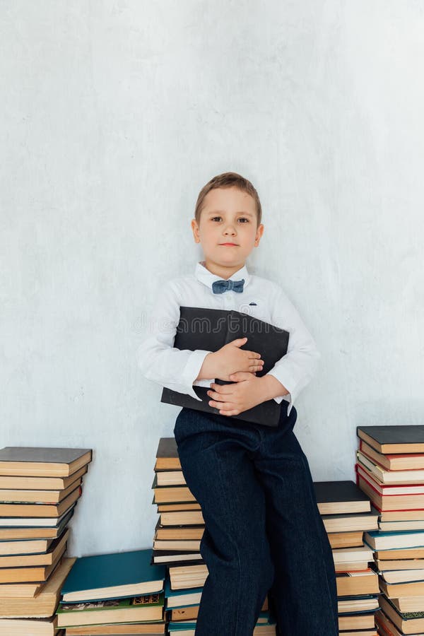 Little Boy Loves To Read Stacks of Books Stock Photo - Image of ...
