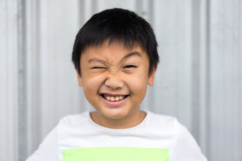 Little boy make funny face stock image. Image of looking - 135917735