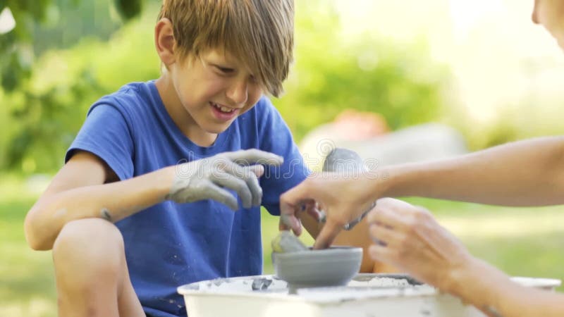 Little Boy Making Ceramic Pot on the Pottery Class. Child Working with ...