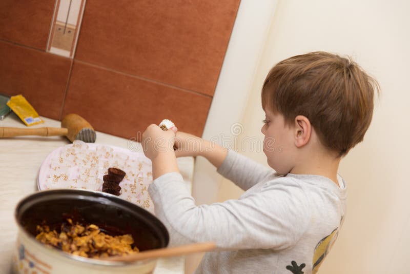 Little boy making cookies stock photo. Image of active - 245437342