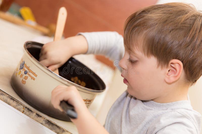 Little boy making cookies stock image. Image of working - 245437367