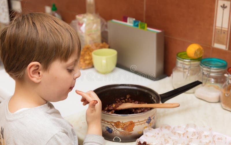 Little boy making cookies stock image. Image of cookies - 245437411