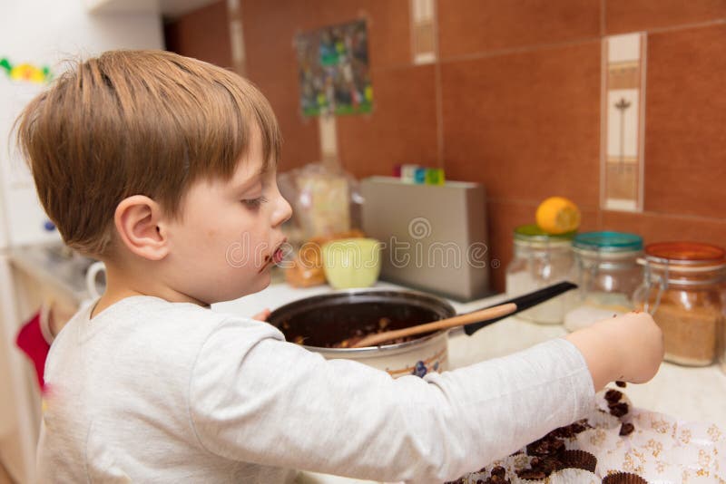 Little boy making cookies stock image. Image of cooking - 245437505