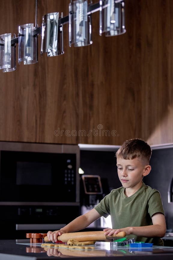 Little Boy Making Cookies Using Cookie Cutters and Dough in the Kitchen ...