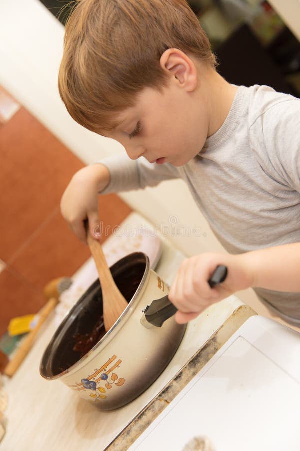 Little boy making cookies stock photo. Image of cooking - 245437308