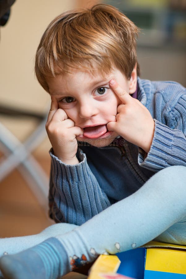 Little boy making faces stock photo. Image of face, indoor - 43611570