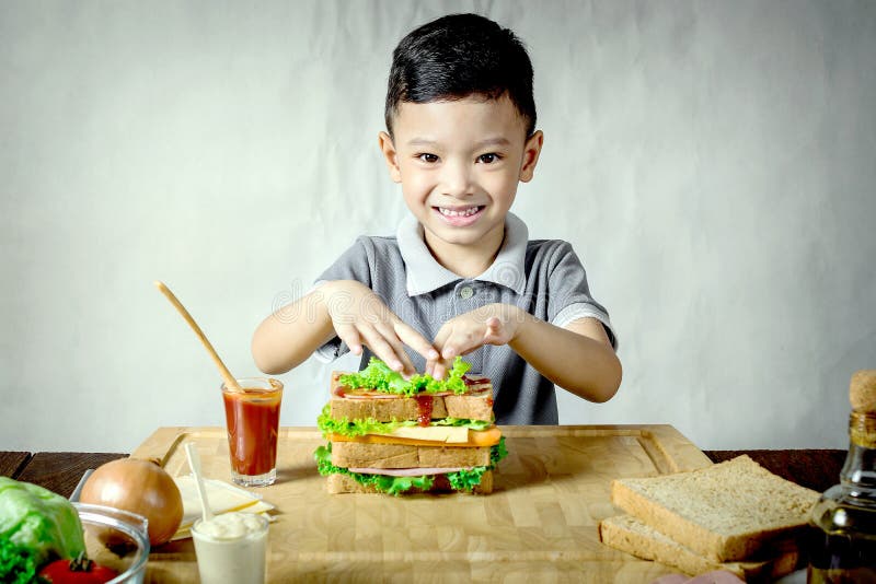 Little Boy Making a Sandwich Stock Photo - Image of sandwich, inside ...