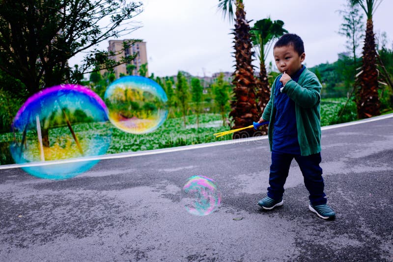 Little Boy Making Soap Bubbles Stock Image - Image of chair, soap ...