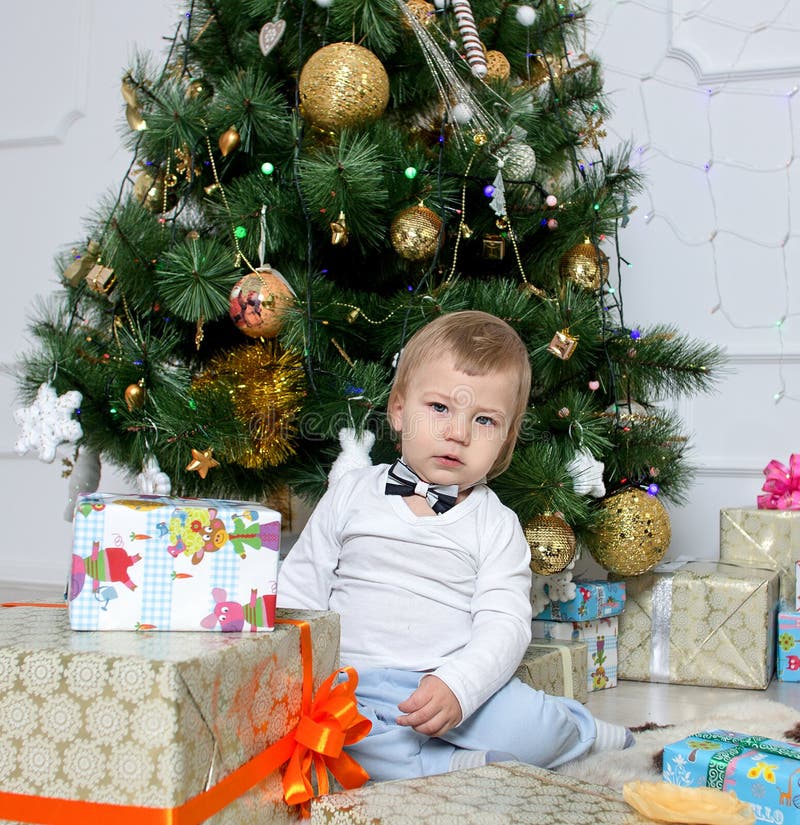 Little Boy Near a Christmas Tree with Gifts Stock Photo - Image of ...