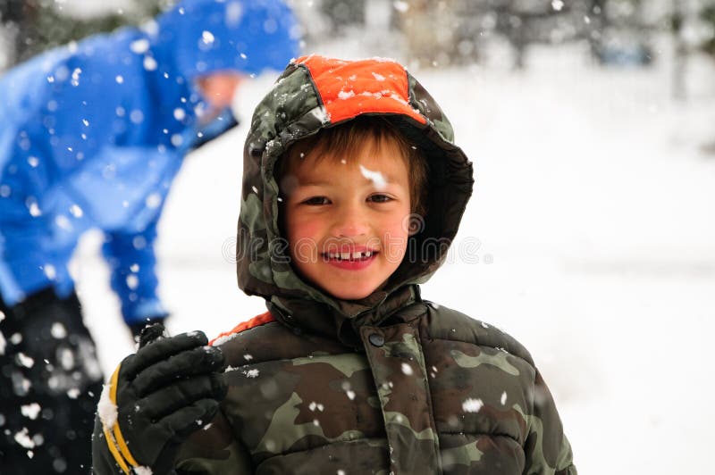 Young boy out in the snow. stock photo. Image of happy - 30003120