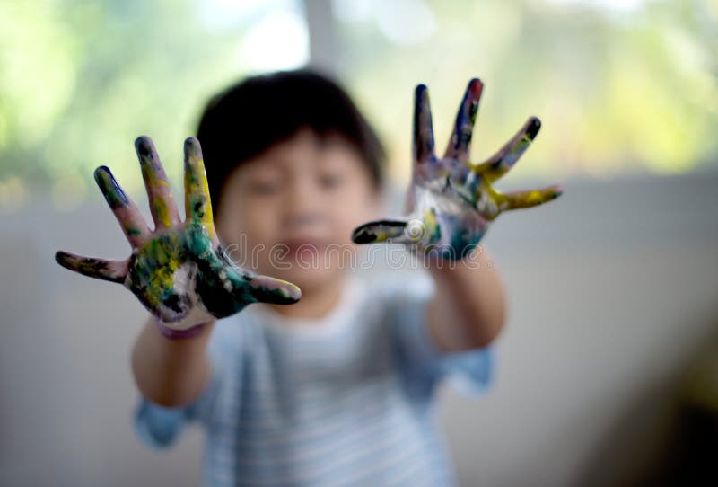 Little Boy Painted Hands in Colorful Paints Background : Out of Stock ...