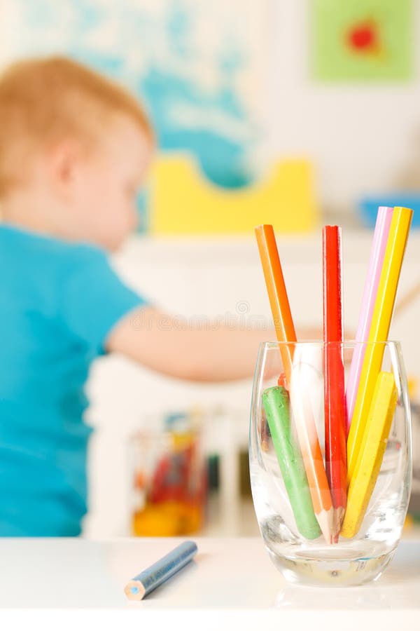 Little boy with pencil stock image. Image of back, actions - 32697203
