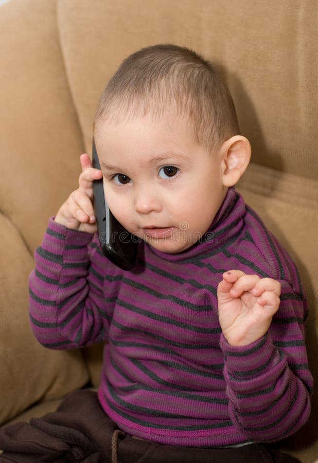 The little boy with phone stock image. Image of childhood - 7537201
