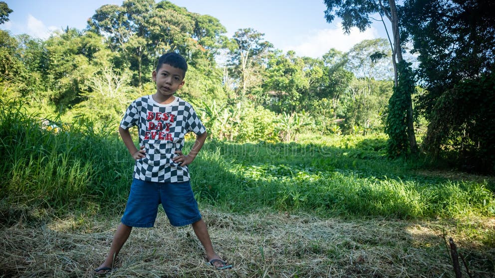 A Little Boy on a Pile of Dry Hay Stock Image - Image of nature ...
