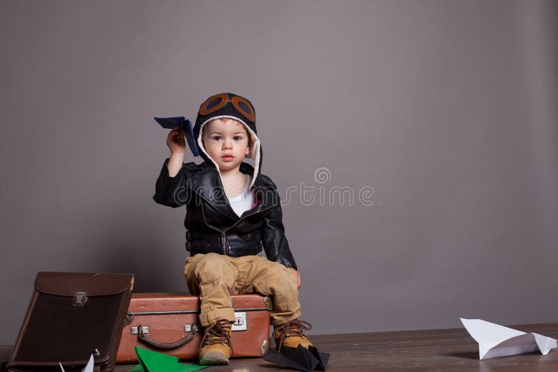 Little Boy Pilot Plays in the Paper Plane Stock Photo - Image of paper ...