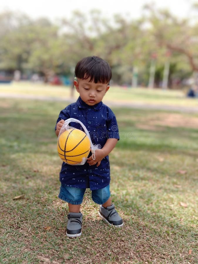 Little Boy Play Ball in the Yard so Handsome Stock Photo - Image of ...