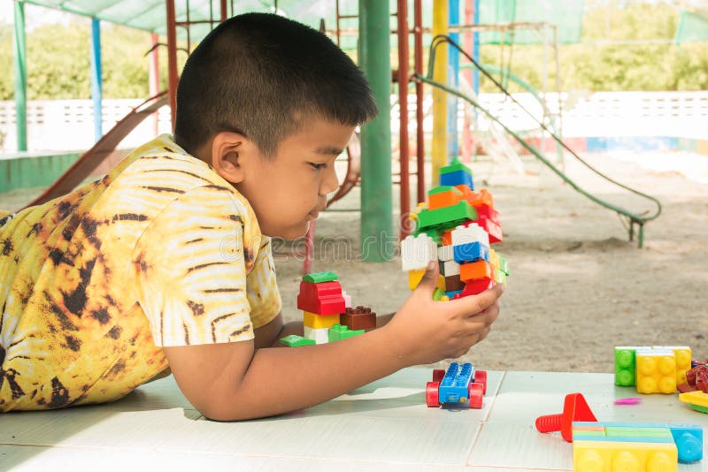 Little Boy Play Building Brick at Playground Stock Image - Image of ...