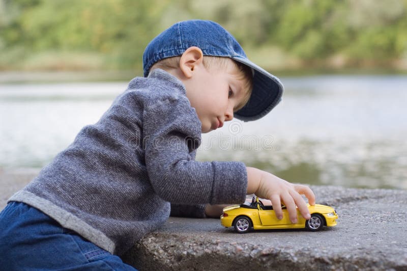 Little boy play with a car stock photo. Image of person - 6387228
