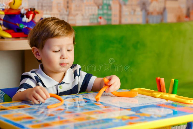 Little boy play stock image. Image of table, plays, smile - 87565225