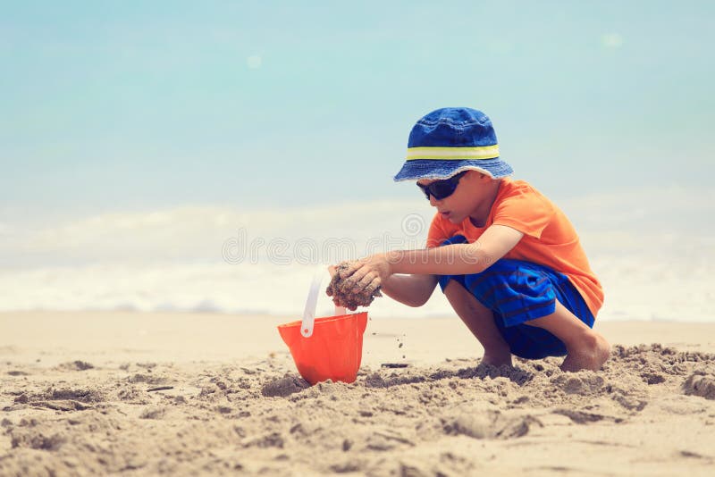 Little Boy Play with Sand on Beach Stock Photo - Image of sand, child ...