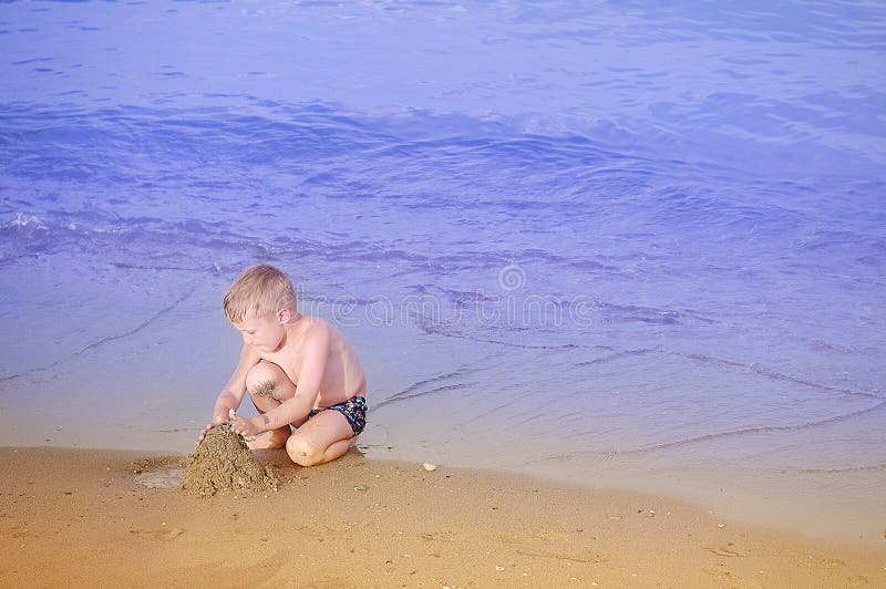 Boy on the Beach Playing in the Sand Stock Photo - Image of little ...
