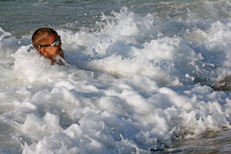 Little boy play with waves stock image. Image of travel - 108999813