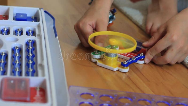 Little Boy is Played with a Propeller Toy, a Toy Designer Stock Footage ...