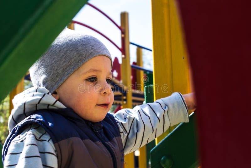 Little boy on playground stock photo. Image of child - 91612080