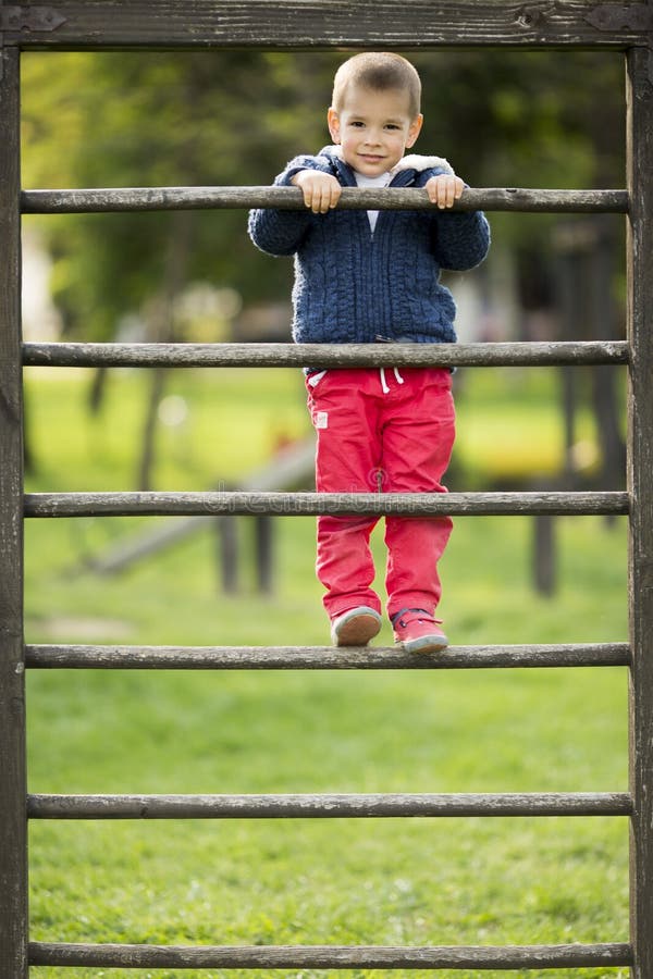 Little boy at playground stock photo. Image of little - 40022112