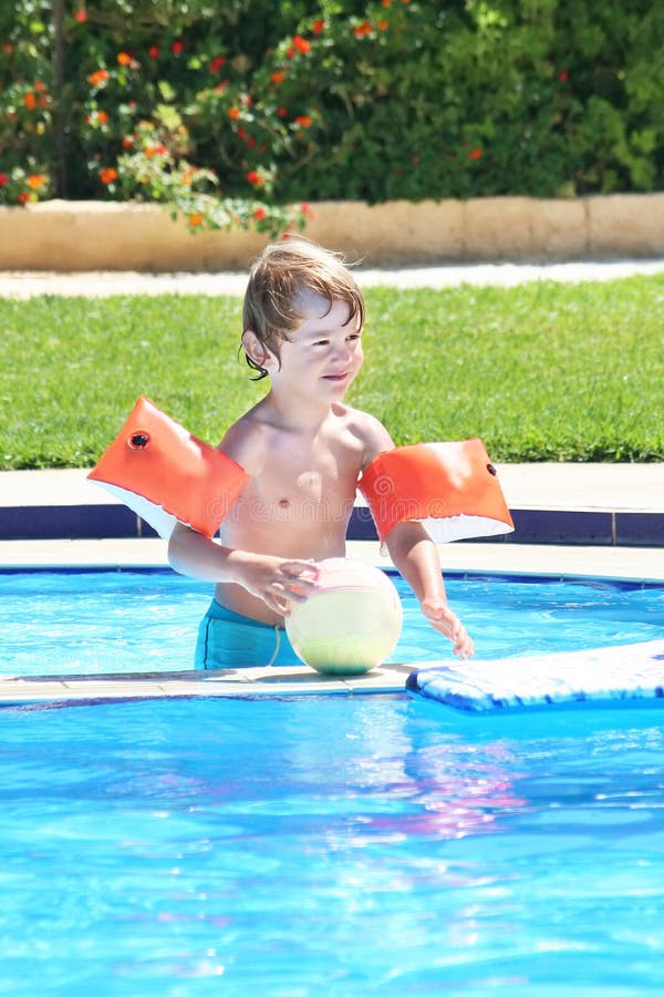 Little Boy Playing with a Ball in a Swimming Pool Stock Photo - Image ...