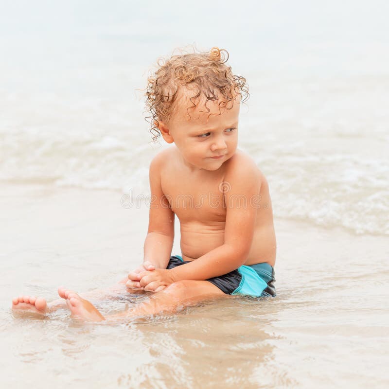 Little Boy Playing on the Beach. Stock Image - Image of playful, happy ...
