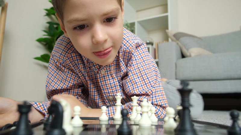 Little Boy Playing Chess. Board Games for Children Stock Footage ...