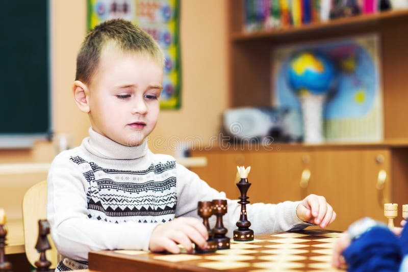 Little boy playing chess stock photo. Image of intelligent - 45276220