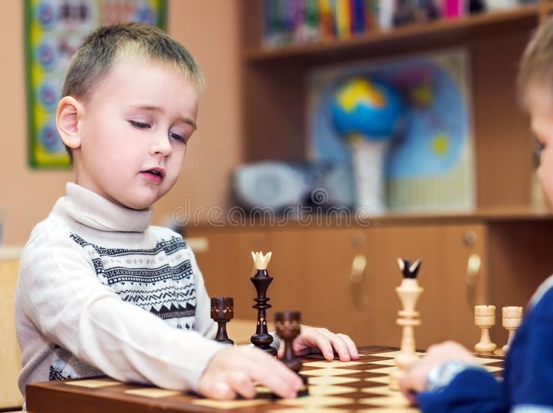 Little boy playing chess stock photo. Image of little - 45276180