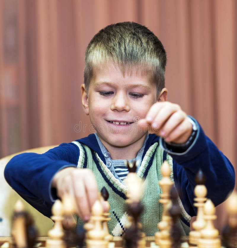 Little boy playing chess stock photo. Image of junior - 45276464