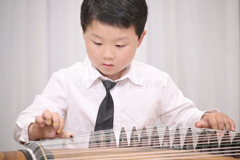Little Boy Playing the Chinese Zither Stock Photo - Image of chinese ...